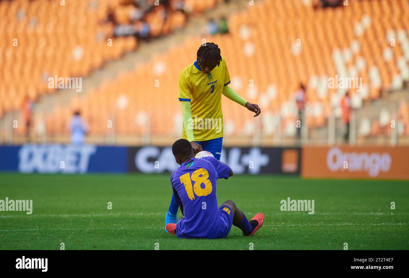 Diana Mnally helping goalkeeper Najat Abbas to her feet during their ...