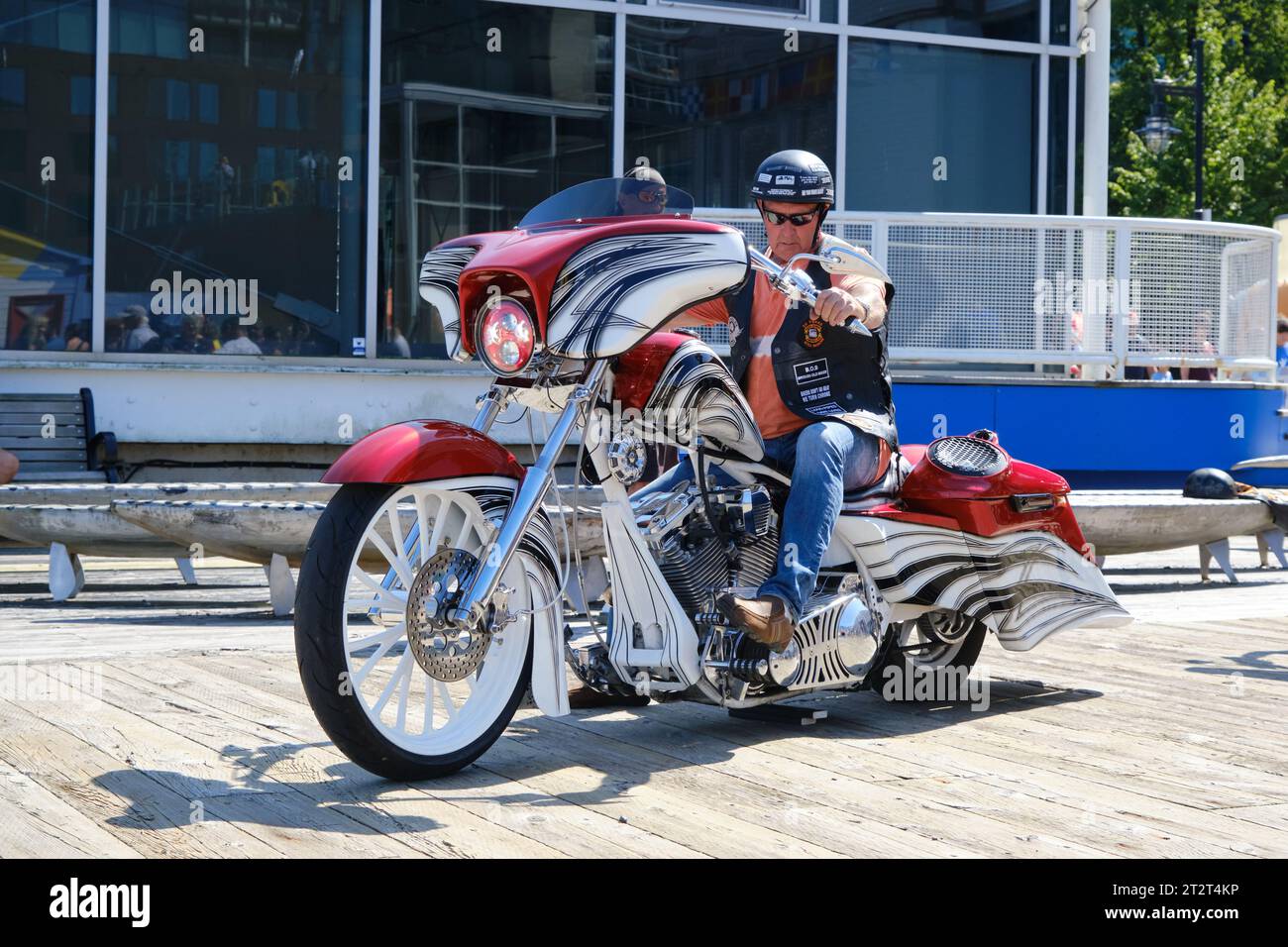 man on colourful vintage motorcycle riding demonstration on halifax ...