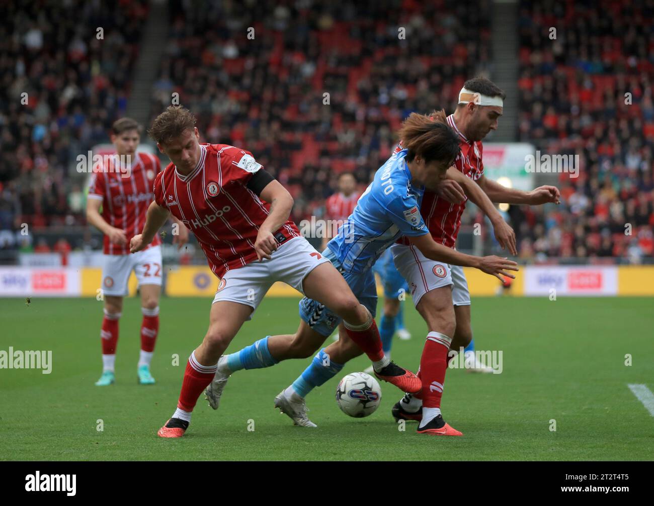 Coventry City's Tatsuhiro Sakamoto (centre) battle for the ball with ...