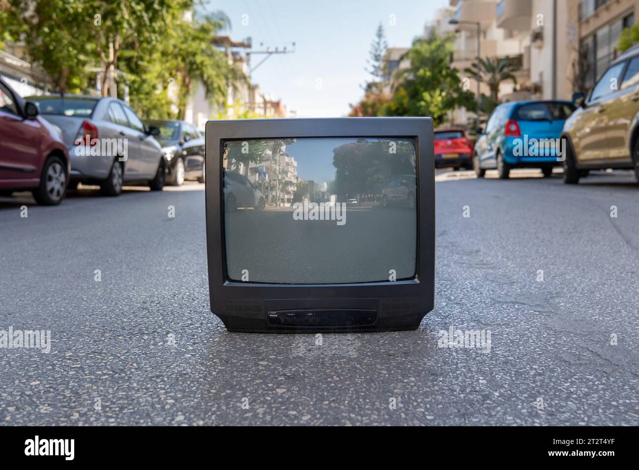 Old TV set on the city street with cars Stock Photo - Alamy