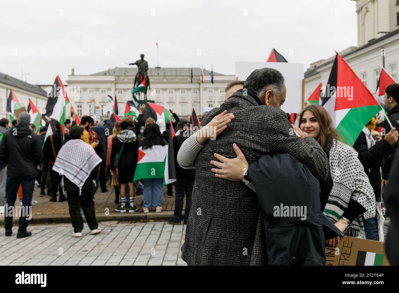Protesters embrace upon meeting near the Presidential Palace during the ...