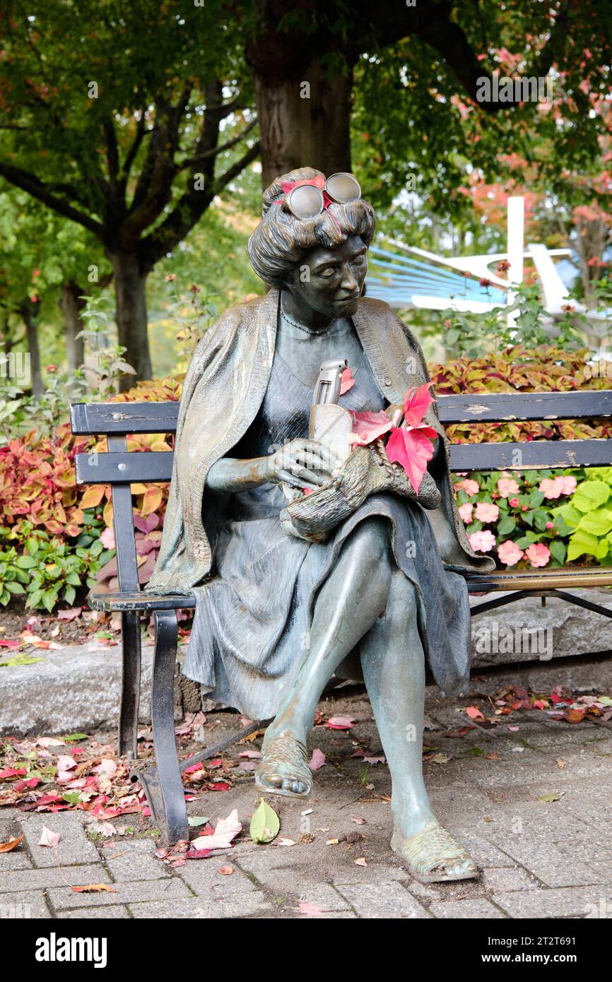 Search , statue of an old lady with flowers sitting on a bench in ...