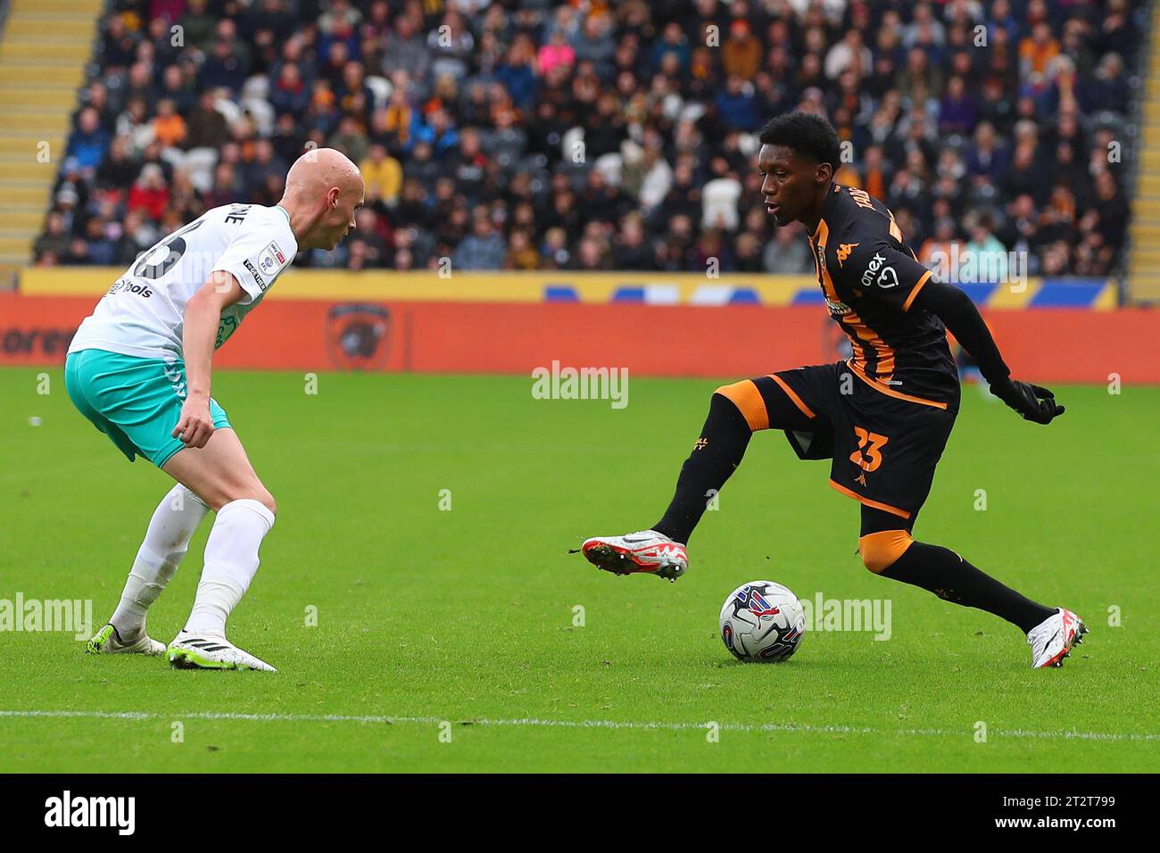 Jaden Philogene of Hull City looks to get past Will Smallbone of ...