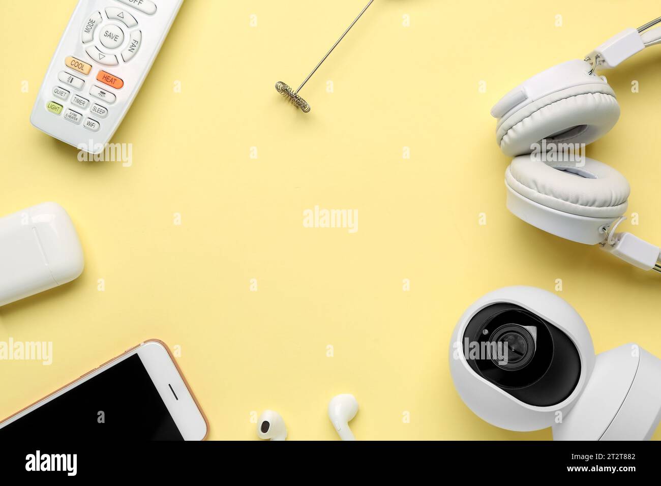 Frame made of modern gadgets on yellow background Stock Photo - Alamy