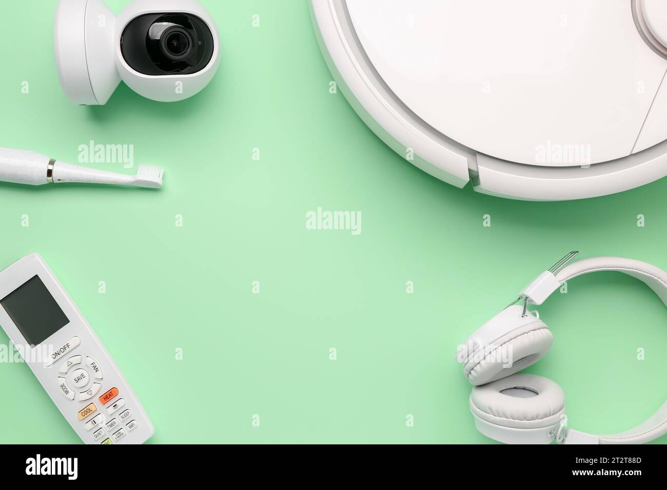 Frame made of modern gadgets on green background Stock Photo - Alamy
