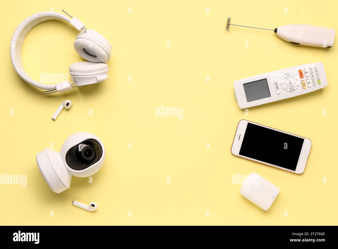 Frame made of modern gadgets on yellow background Stock Photo - Alamy