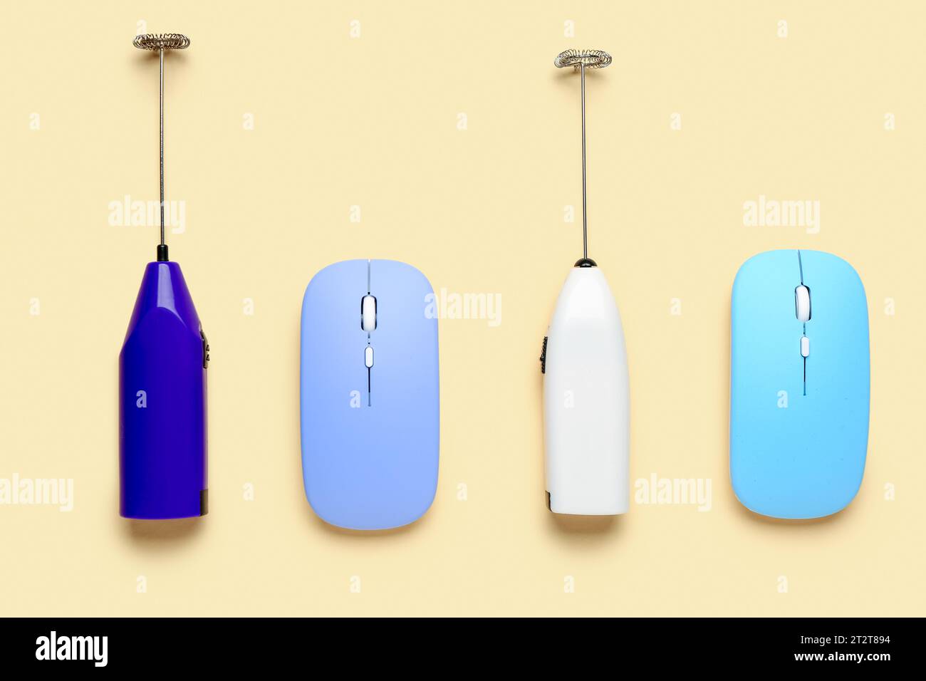Computer mouses with mixers on beige background Stock Photo - Alamy