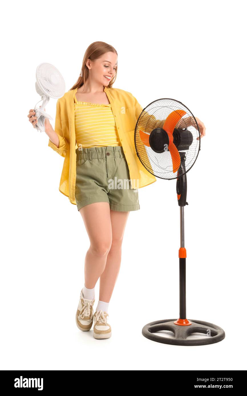 Young woman with electric fans on white background Stock Photo - Alamy