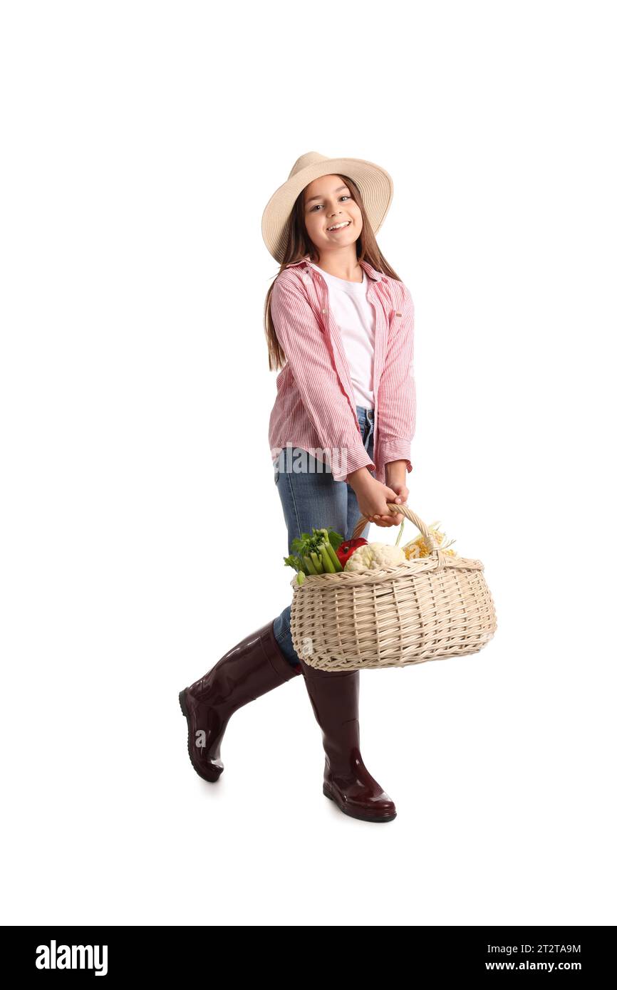 Little farmer with fresh food on white background Stock Photo - Alamy
