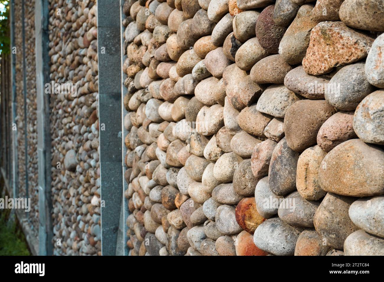 Stunning aesthetic wall made of arranged stones with iron braces Stock ...