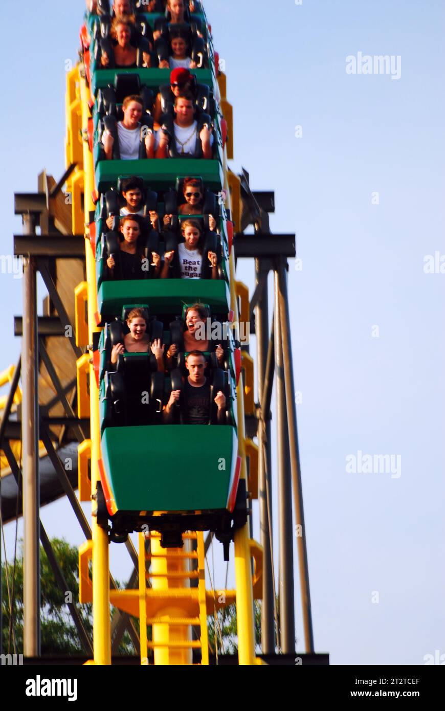 A roller coaster takes a plunge as it descends on a ride in an ...