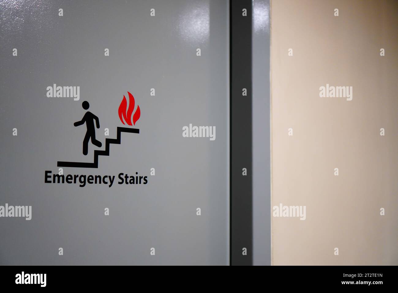 Signage pointing to emergency stairway on multi-level structure Stock ...