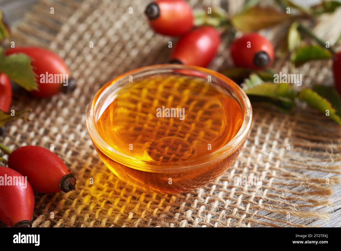 Rose hip seed oil in a glass bowl Stock Photo - Alamy