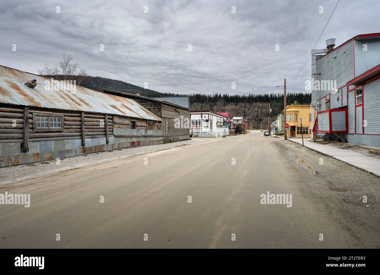 Historic wooden buildings line a street in Dawson City, Yukon, Canada ...