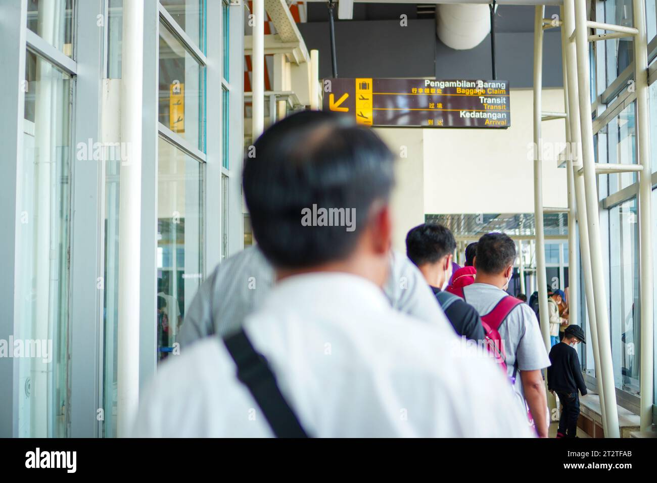 Journey Continues: Passengers Queue Up for Transit at the Airport Stock ...