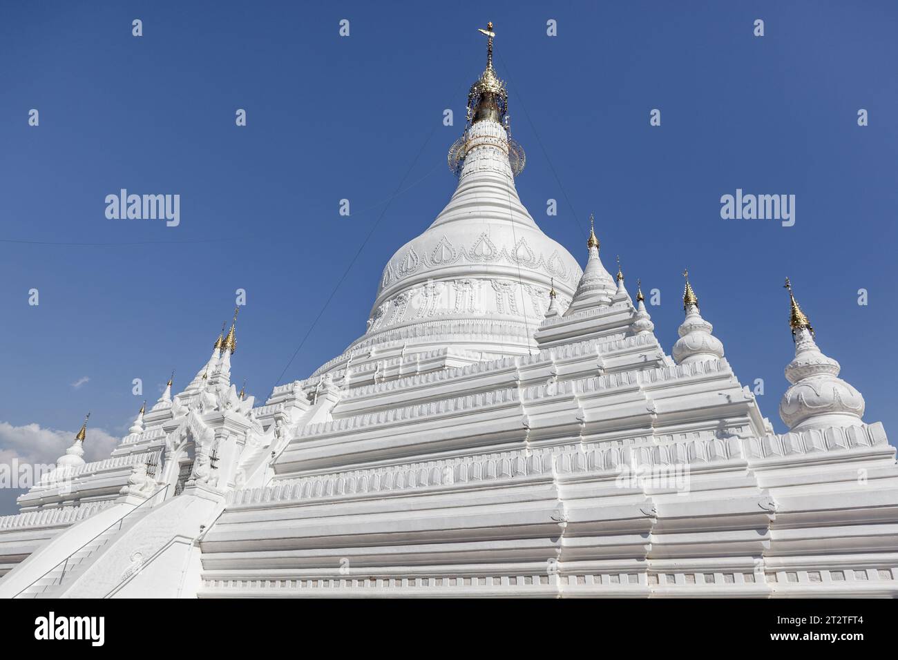 Pahtodawgyi Pagoda in Myanmar. White Buddhist stupa on blue sky ...