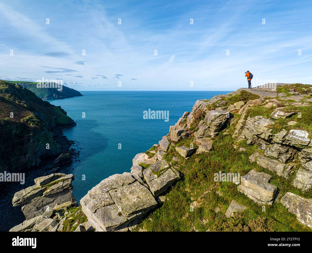 Photographer shooting the Valley of Rocks, a dry valley that runs ...