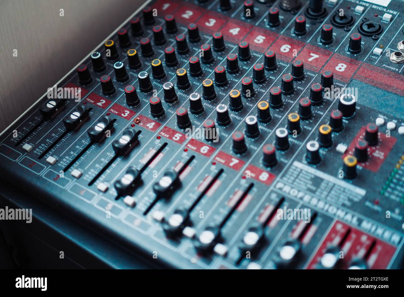 Detailed view of sound mixer featuring an array of buttons and sliders ...