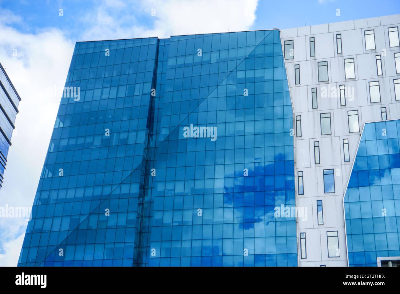 The future is now: a sleek, modern office tower with a stunning blue ...