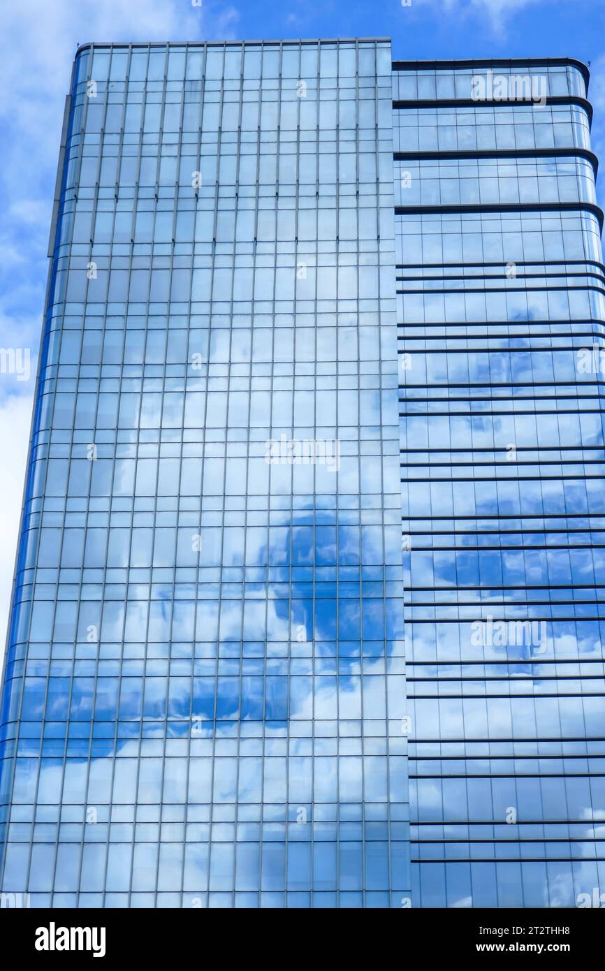 The future is now: a sleek, modern office tower with a stunning blue ...