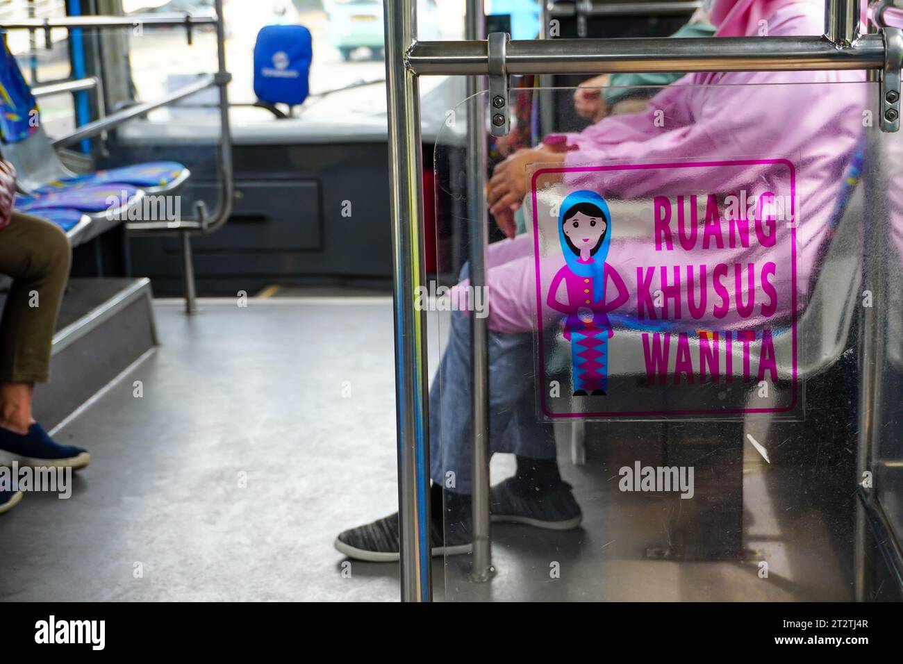 a close-up shot of a sticker on a bus seat indicating it's a special ...