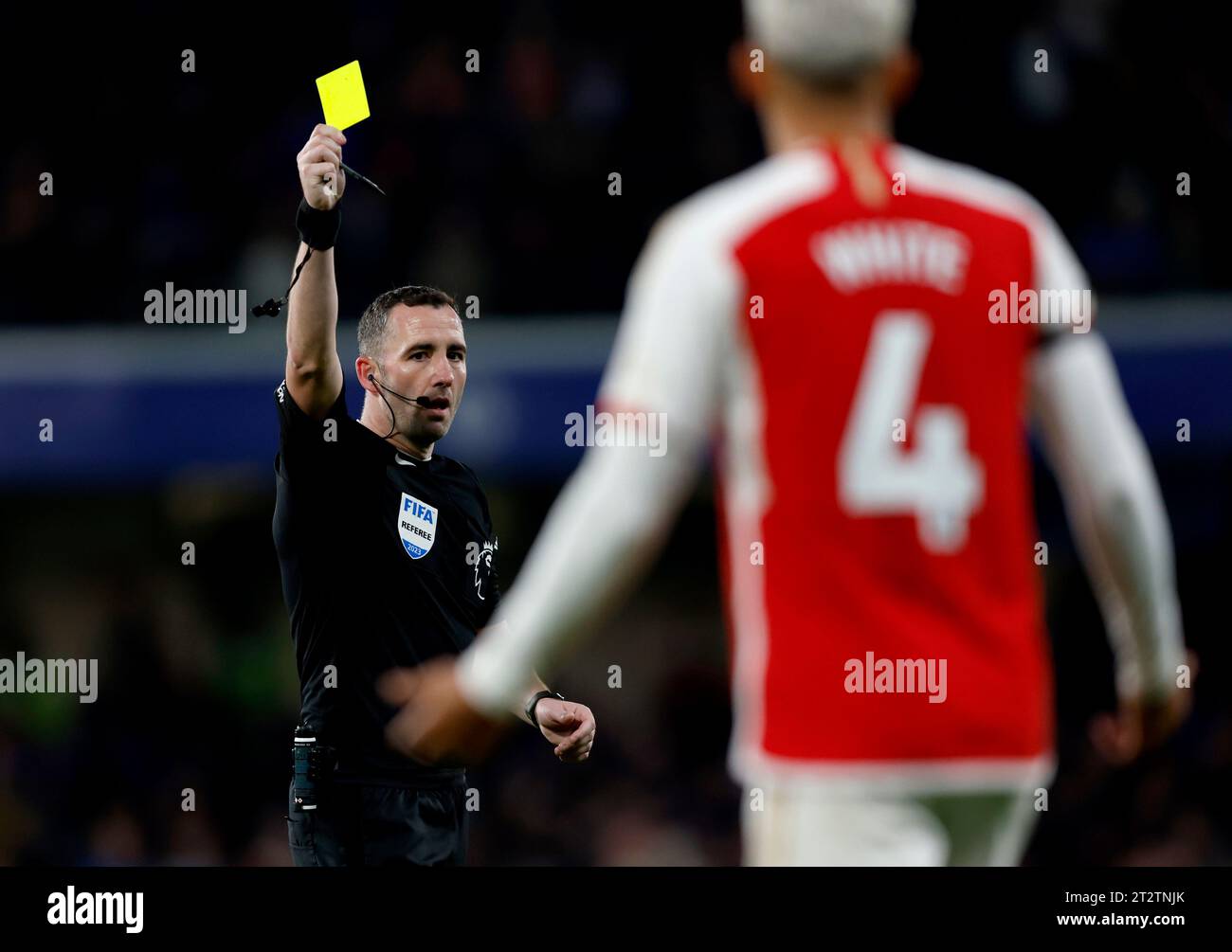 Referee Chris Kavanagh shows a yellow card during the Premier League ...