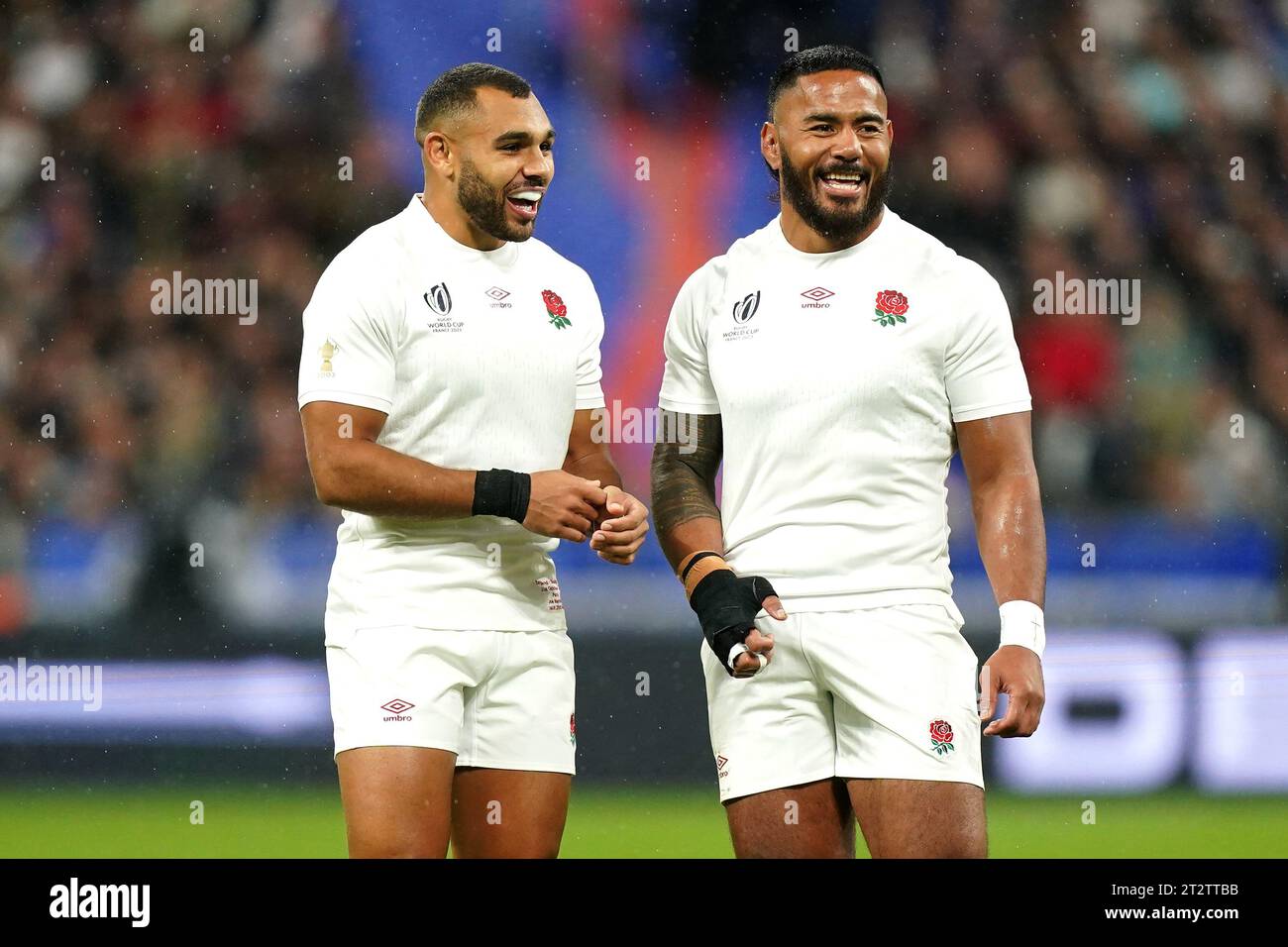 England's Joe Marchant (left) and England's Manu Tuilangi smile during ...