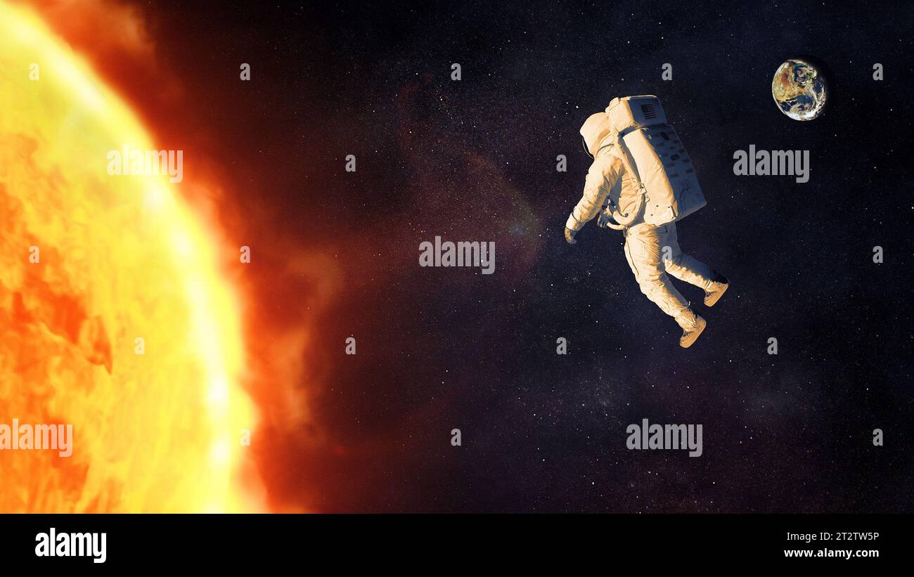 Cosmonaut floating in outer space next to the Sun. Elements of this ...