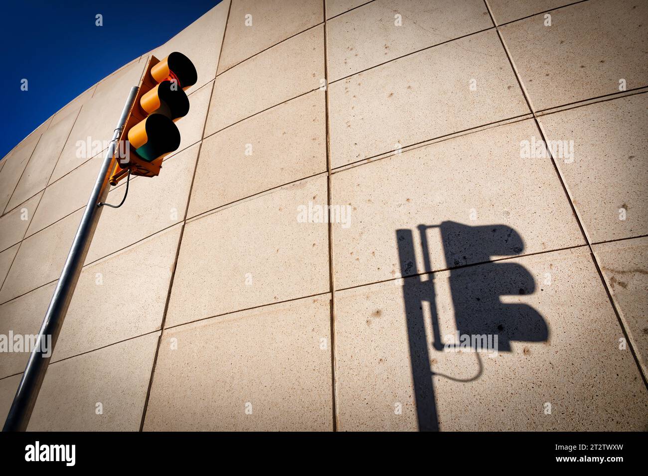 The shadow a traffic signal on the wall of a building in downtown El ...