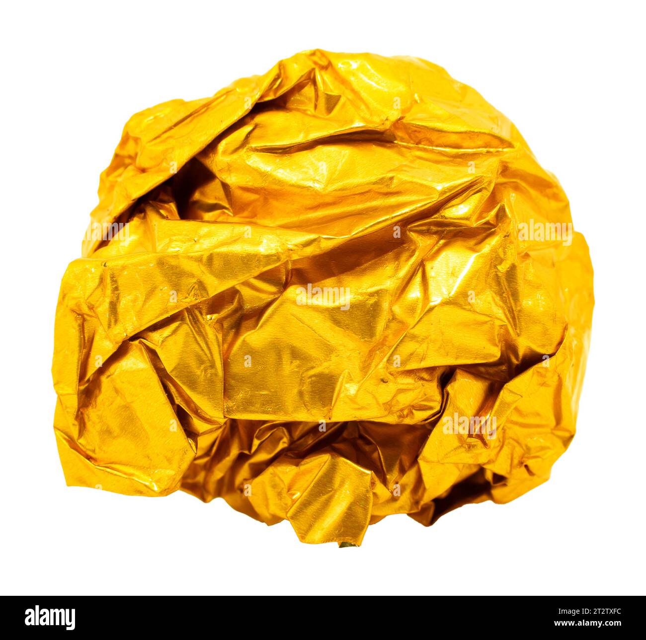 A lump or ball of crumpled yellow golden foil on a white background ...