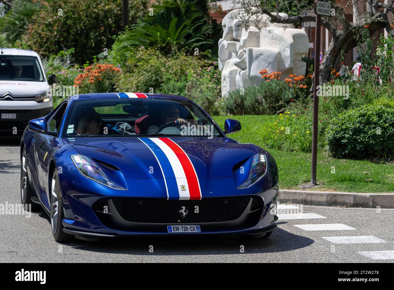 Blue Ferrari 812 Superfast driving on the road Stock Photo - Alamy