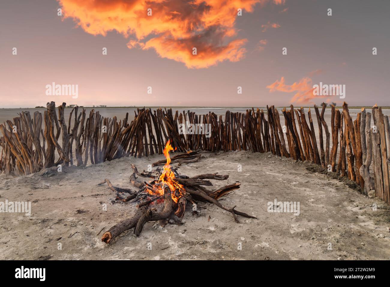 Botswana , in Kalahari desert bonfire surrounded by a wooden fence to ...