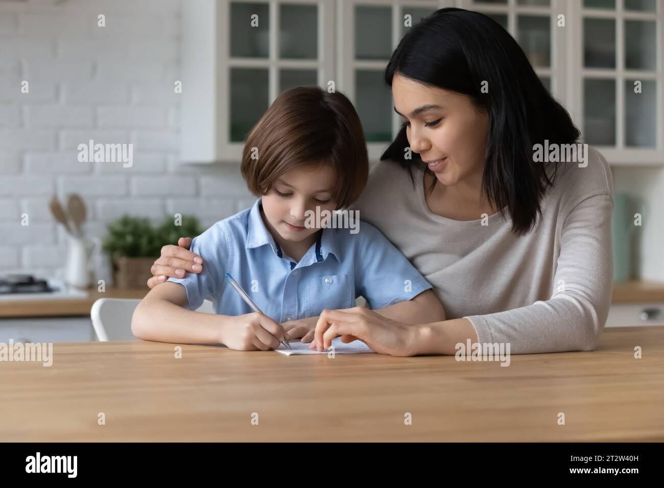 Asian mom helping son homework hi-res stock photography and images - Alamy