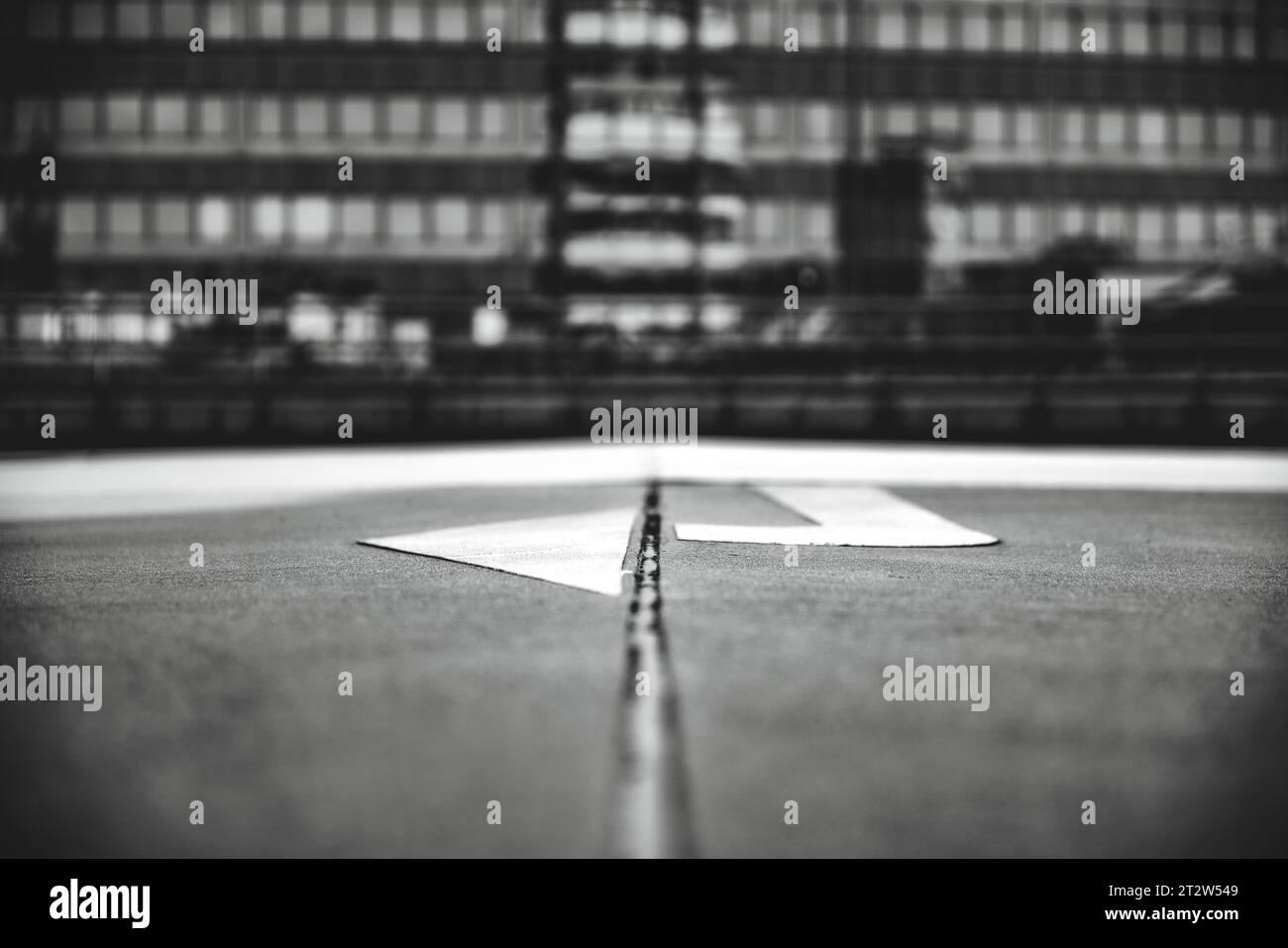 An outdoor baseball field with lush green grass, featuring a batter ...
