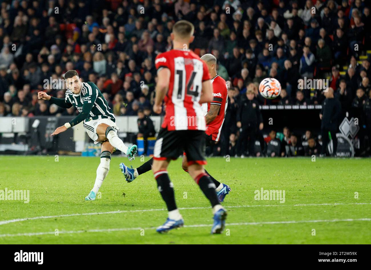 Manchester United's Diogo Dalot (left) scores his sides second goal of ...