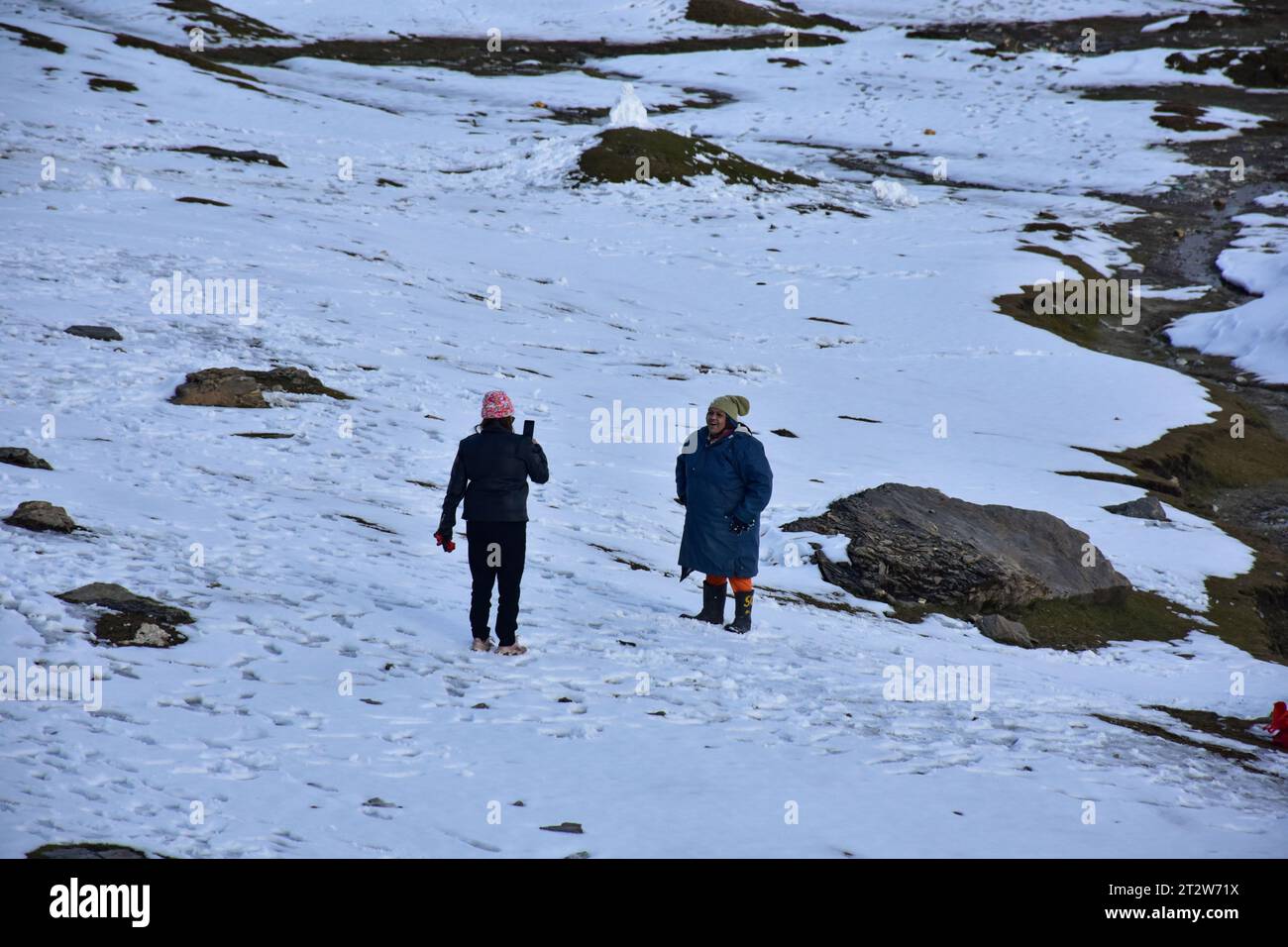 Indian tourists take pictures after fresh snowfall in Drass, a second ...