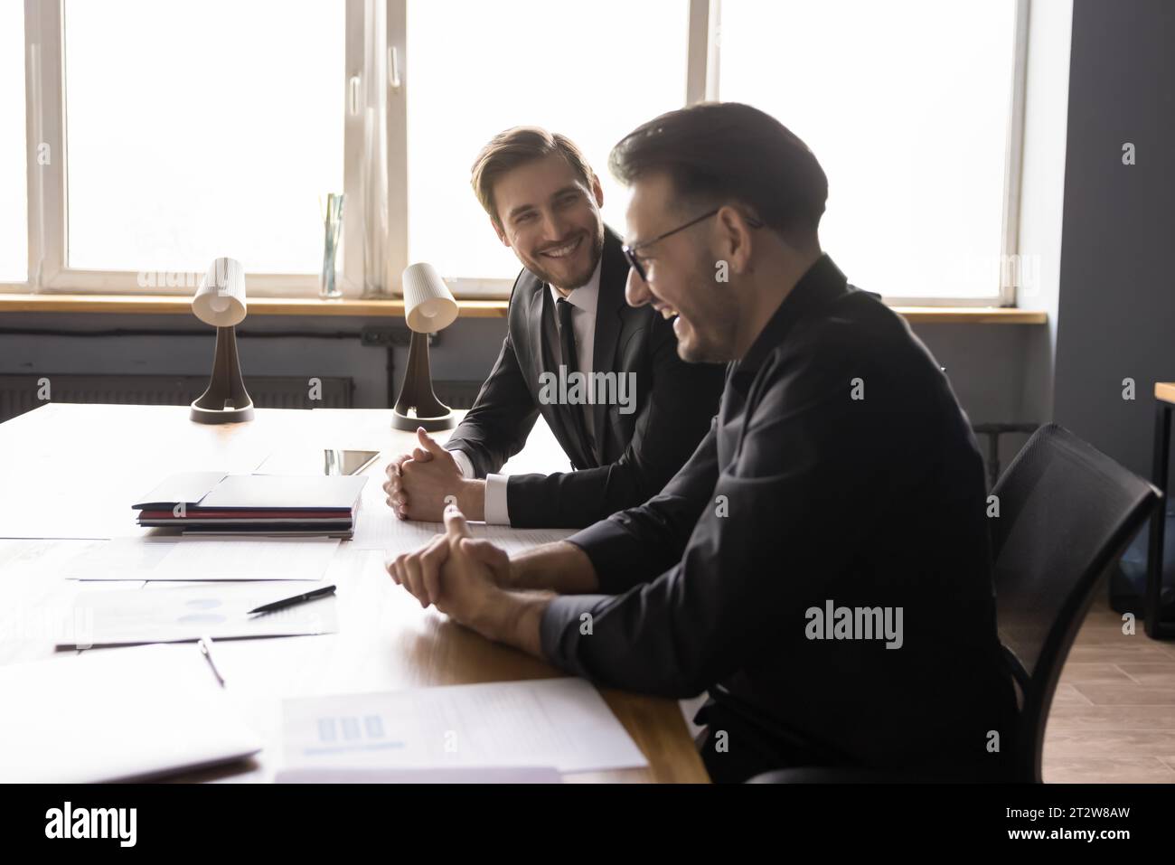 Two businessmen having fun Stock Photo - Alamy