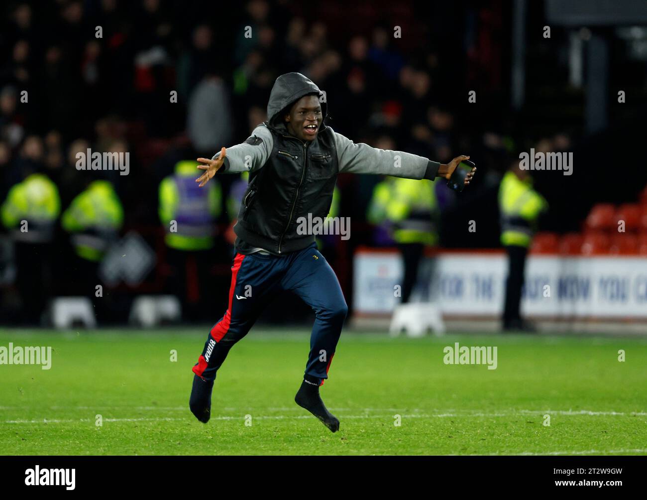 A fan celebrates after having his photograph taken with Manchester ...