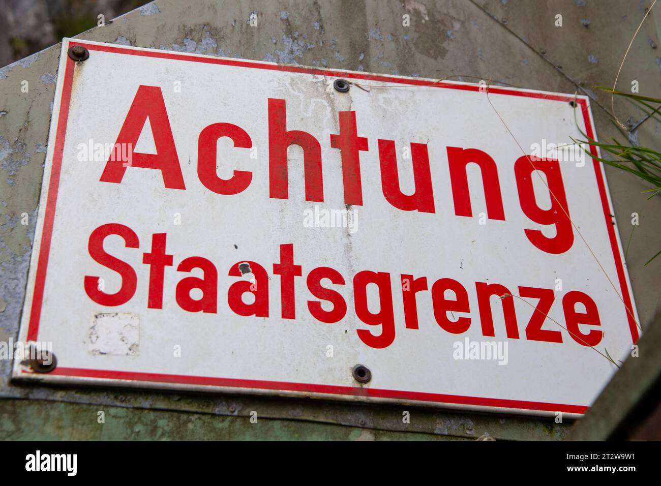Sign with the german inscription ACHTUNG STAATSGRENZE (Attention State ...