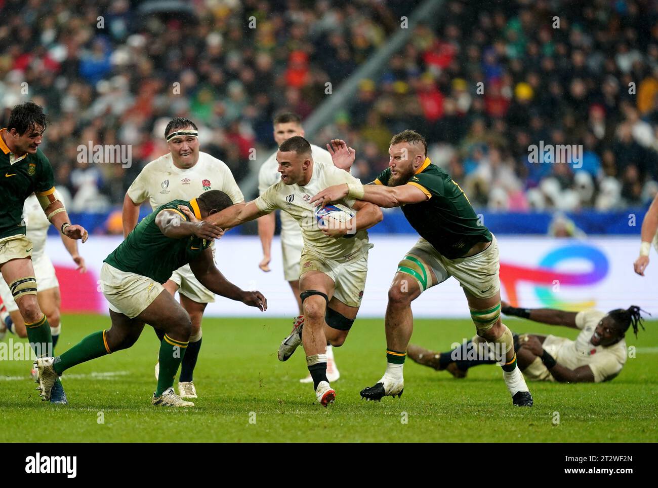 England's Ben Earl (centre) is tackled by South Africa's RG Snyman ...