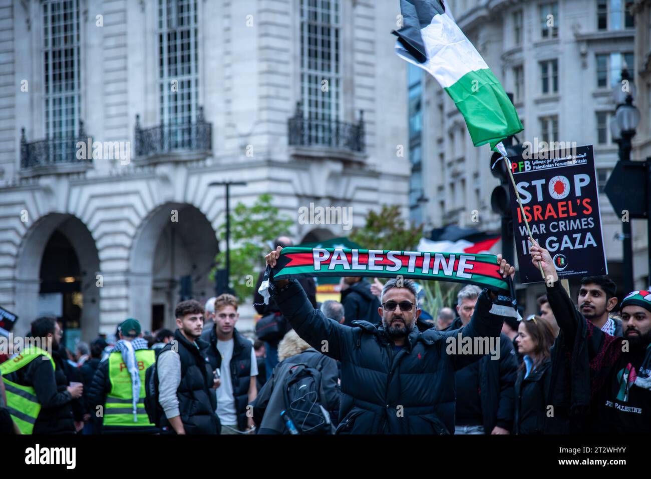 A protestor marches with a banner during the National March for ...