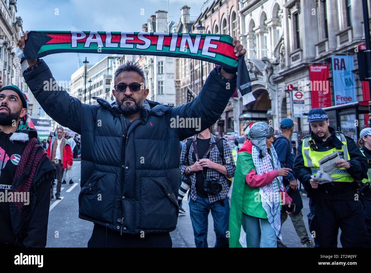 A protestor marches with a banner during the National March for ...