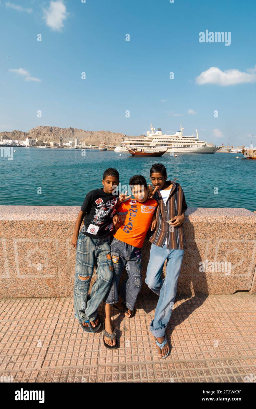 3 Local Young men pose for the camera in Mutrah Muscat in Oman Stock ...