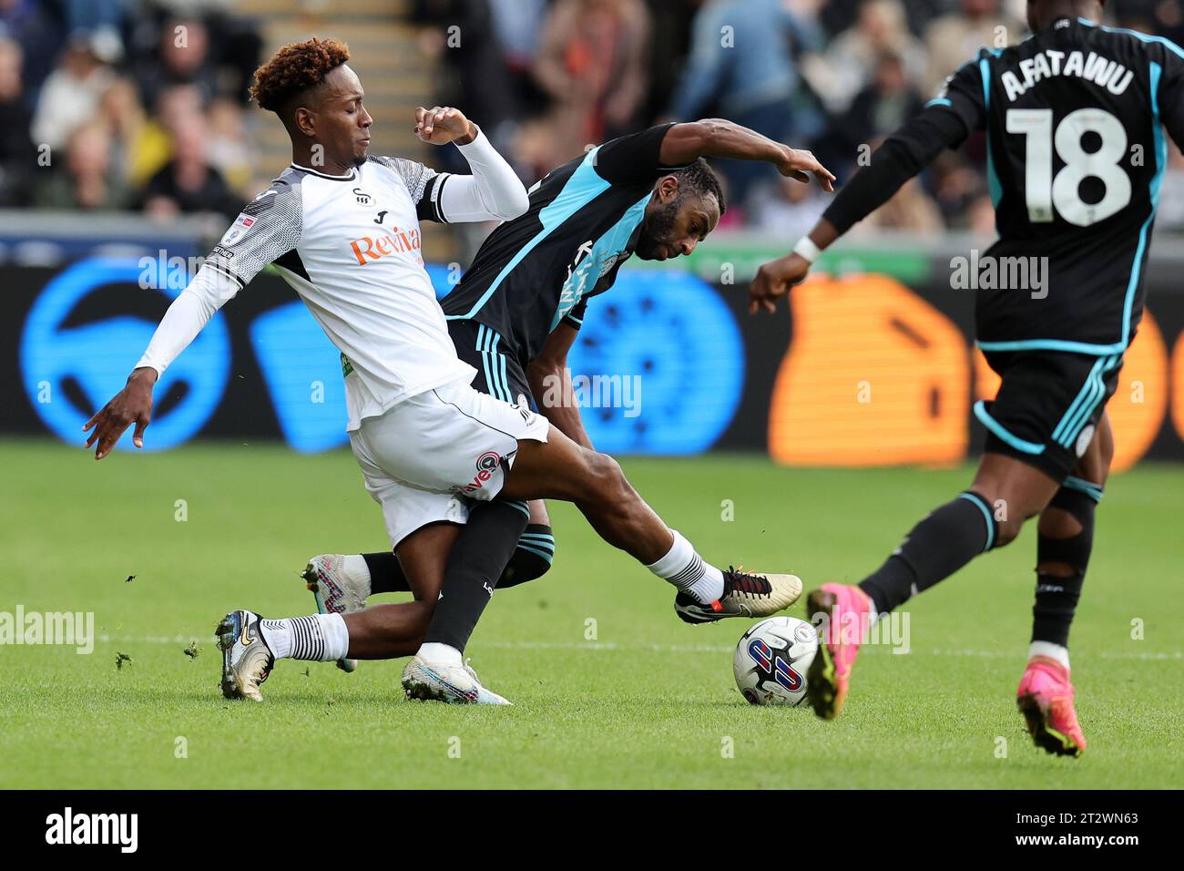 Swansea, UK. 21st Oct, 2023. Jamal Lowe of Swansea City (l) in action ...