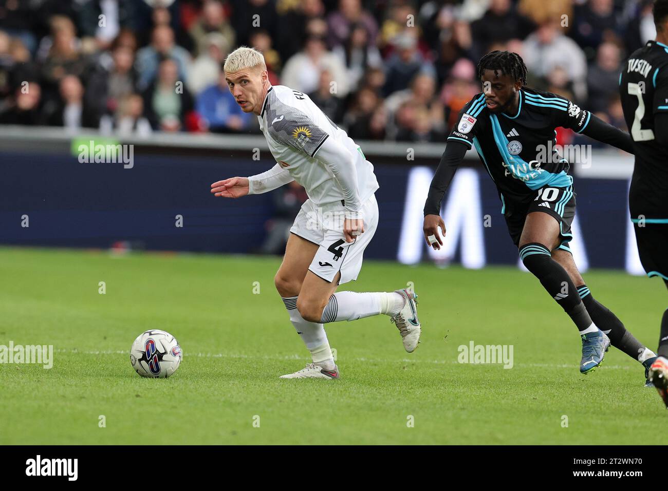 Swansea, UK. 21st Oct, 2023. Jay Fulton of Swansea city (l) in action ...