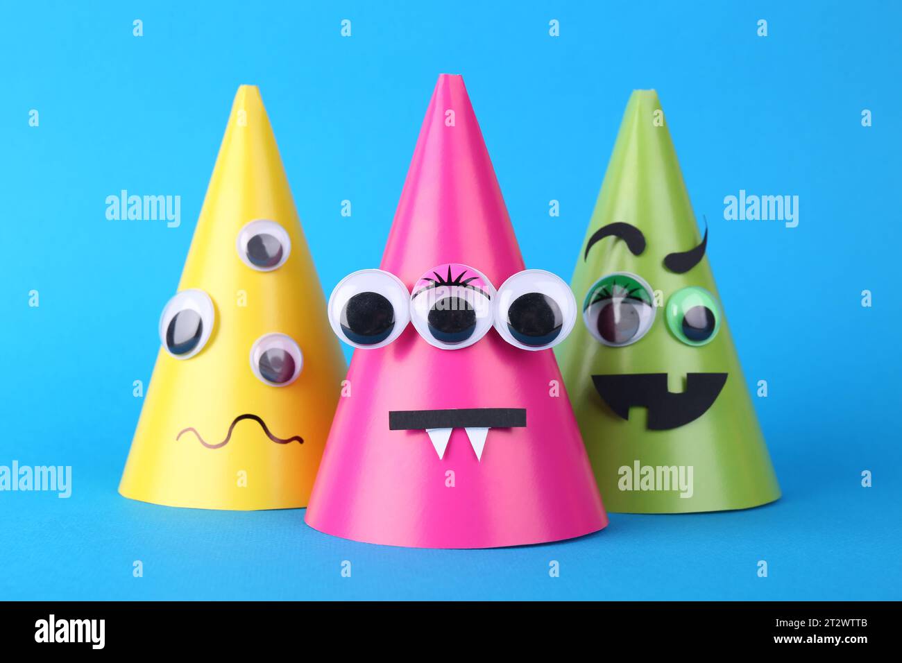 Spooky paper monsters on light blue background. Halloween decoration ...