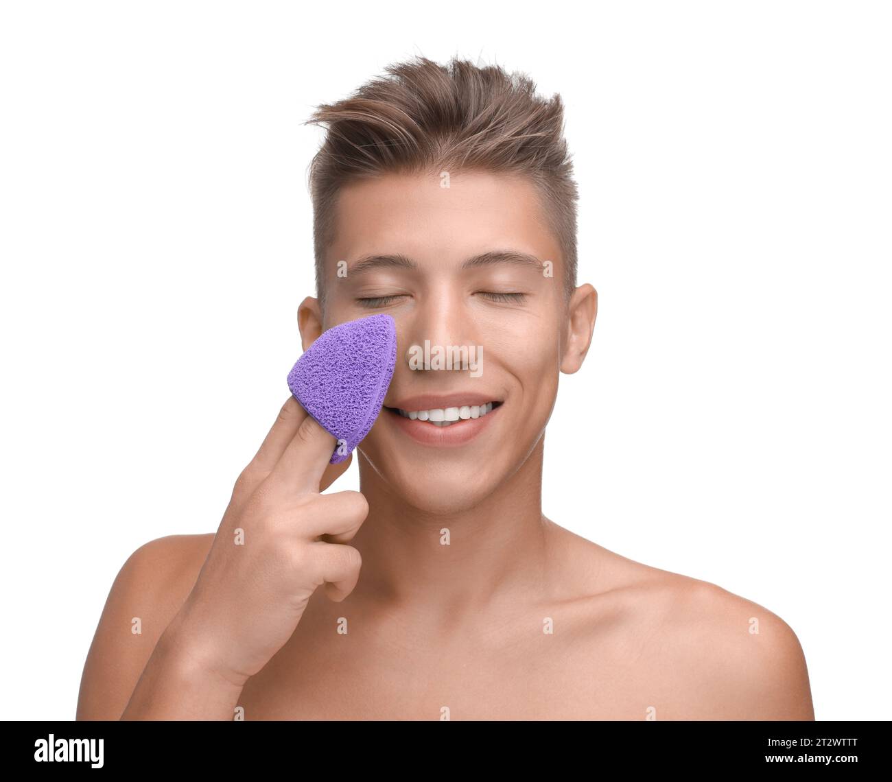 Happy young man washing his face with sponge on white background Stock ...
