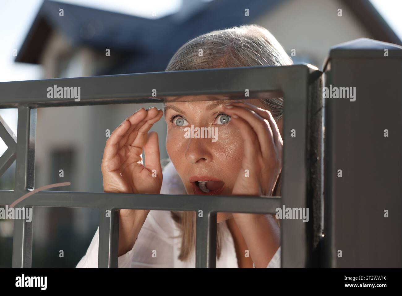 Concept Of Private Life Curious Senior Woman Spying On Neighbours Over