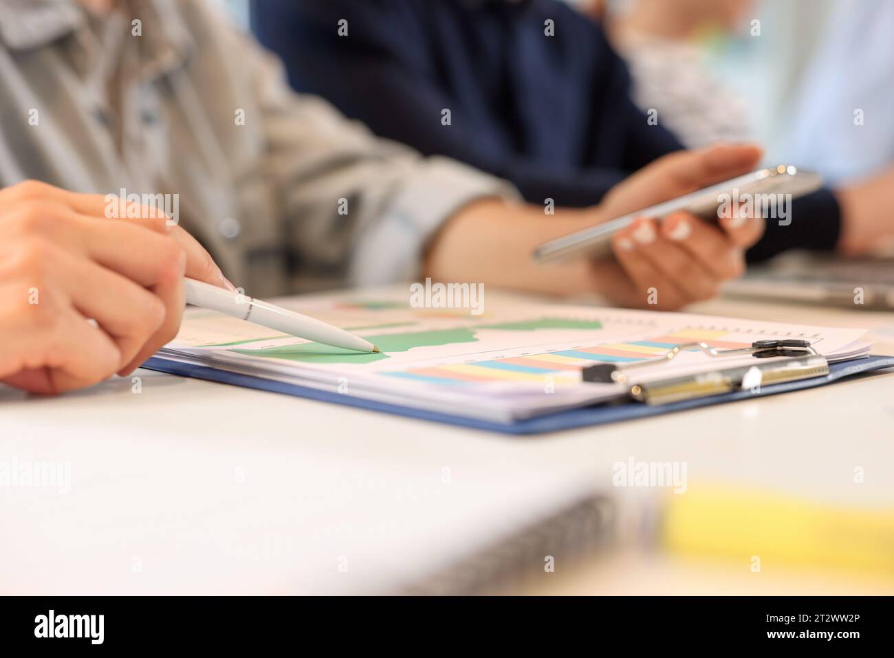 Employees working with charts at table, closeup. Startup project Stock ...