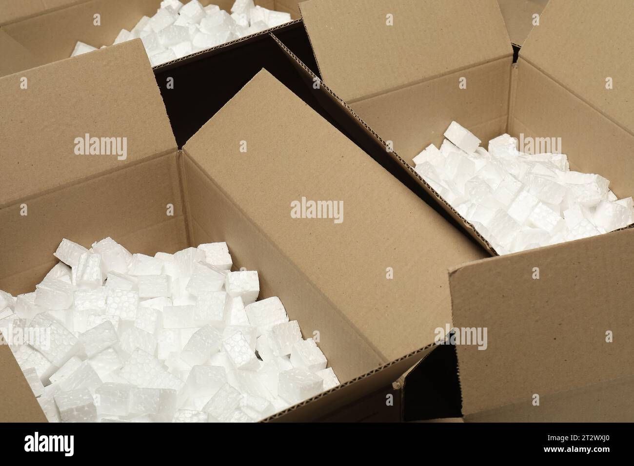 Open cardboard boxes with pieces of polystyrene foam. Packaging goods ...